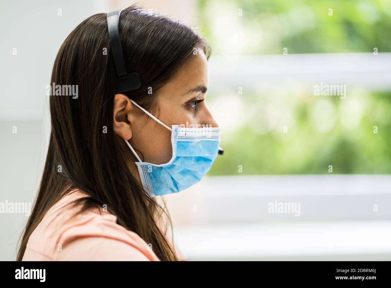 Call Center Telephone Operator In Office Wearing Face Mask Stock Photo ...