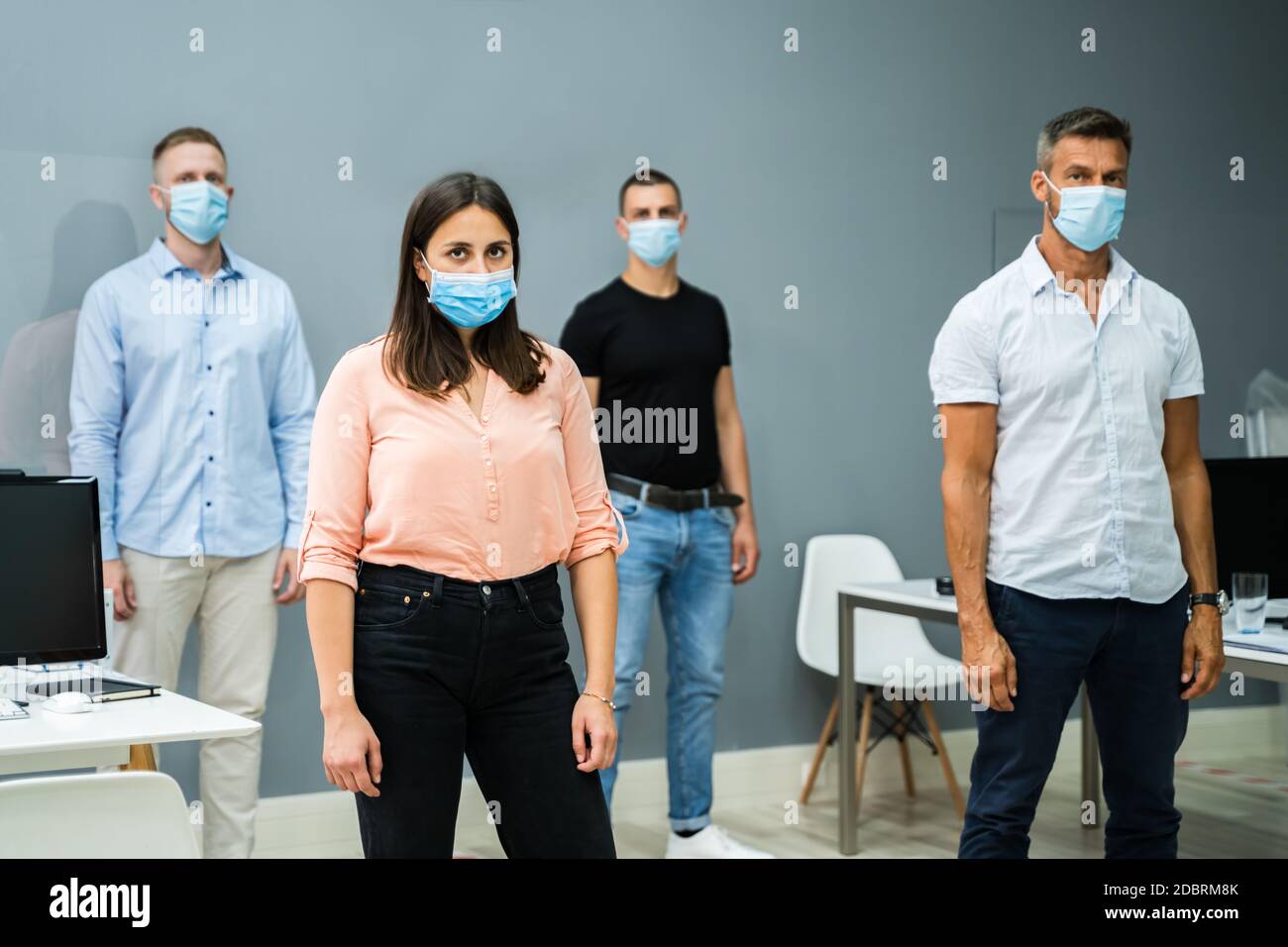 Group Of Office Employees Wearing Medical Face Masks Stock Photo - Alamy