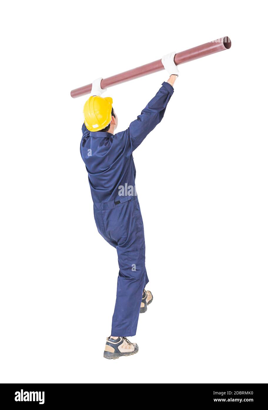 Young plumber in uniform holding pvc pipe isolated on white background ...