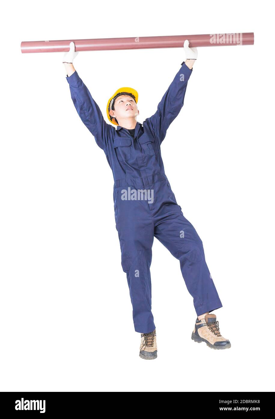 Young plumber in uniform holding pvc pipe isolated on white background ...