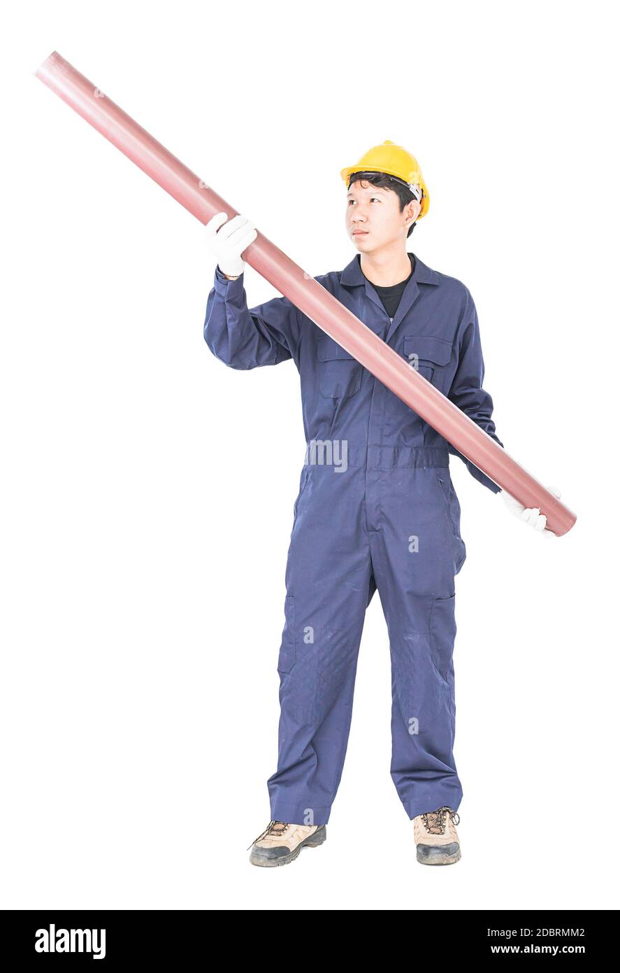 Young plumber in uniform holding pvc pipe isolated on white background ...