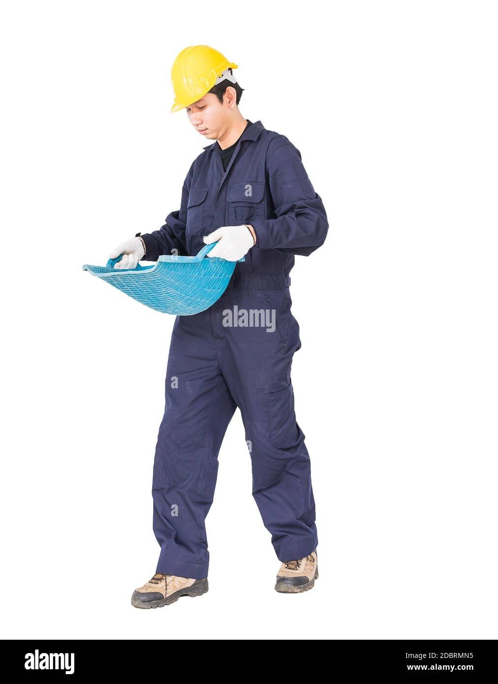 Young worker in uniform hold Hod or clam-shell shaped basket is a ...