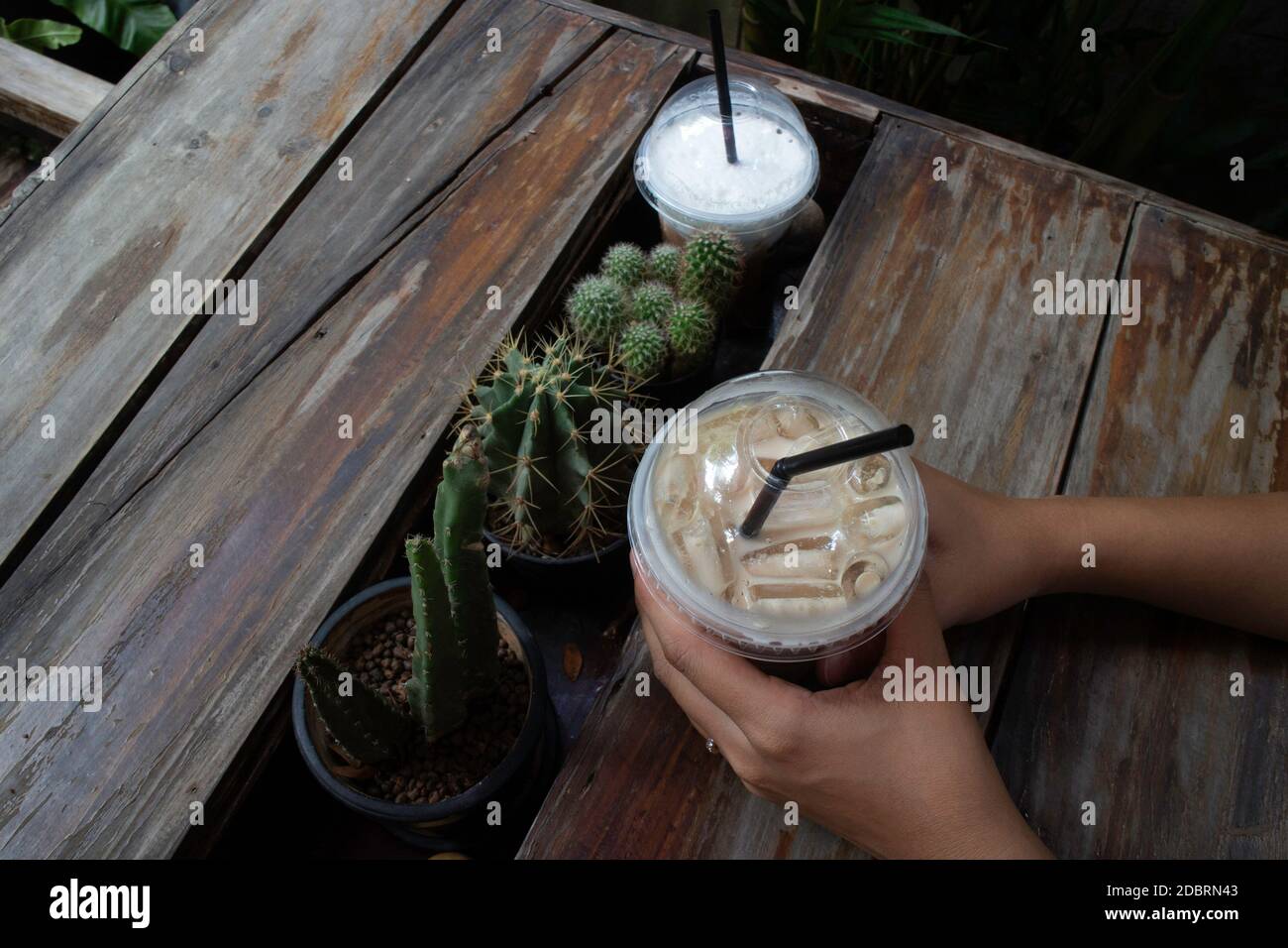 Hand on iced coffee drink, stock photo Stock Photo - Alamy