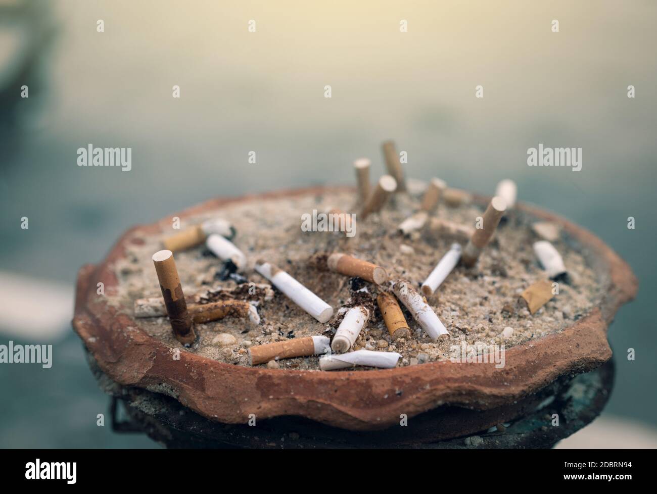 Ashtray full of cigarette butts. Used cigarette in ashtray. Dirty ...