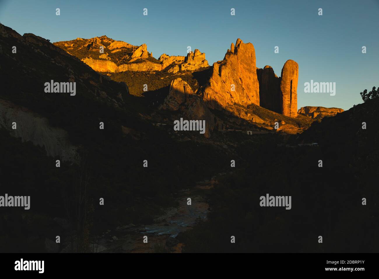 Mountains of the Mallos de Riglos, vertical rock walls at sunset, a ...