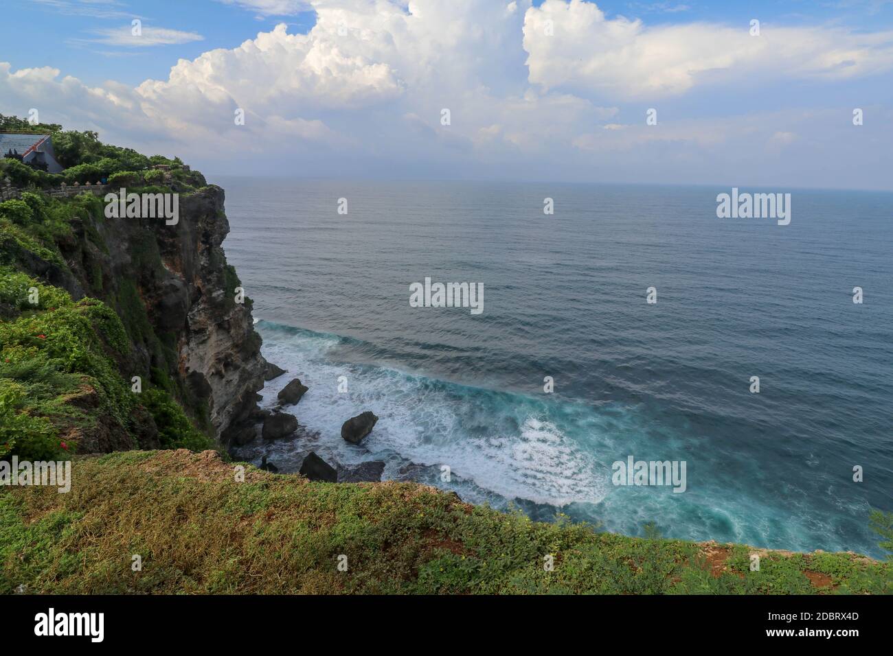 View of Uluwatu cliff with pavilion and blue sea in Bali, Indonesia ...