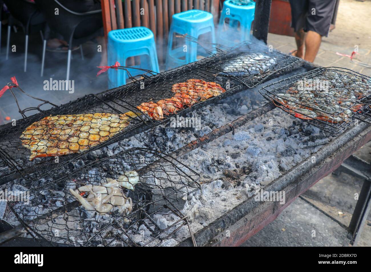 Serving food prepared for barbecue in excellent warung at the fish ...