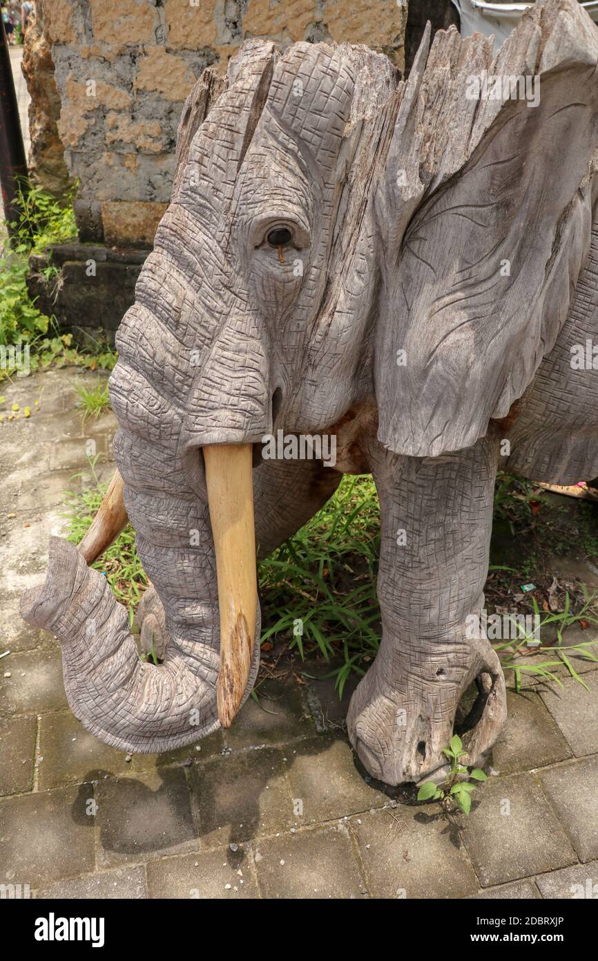 Wooden statue of an elephant. Art and work of Balinese artists. Wooden ...