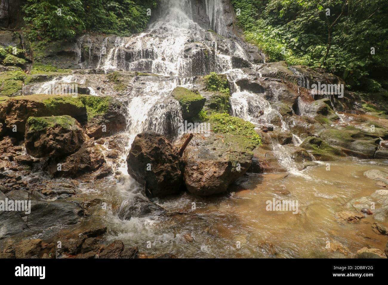 Scenic cascade Goa Giri Campuhan waterfall in tropical jungle in Bali ...