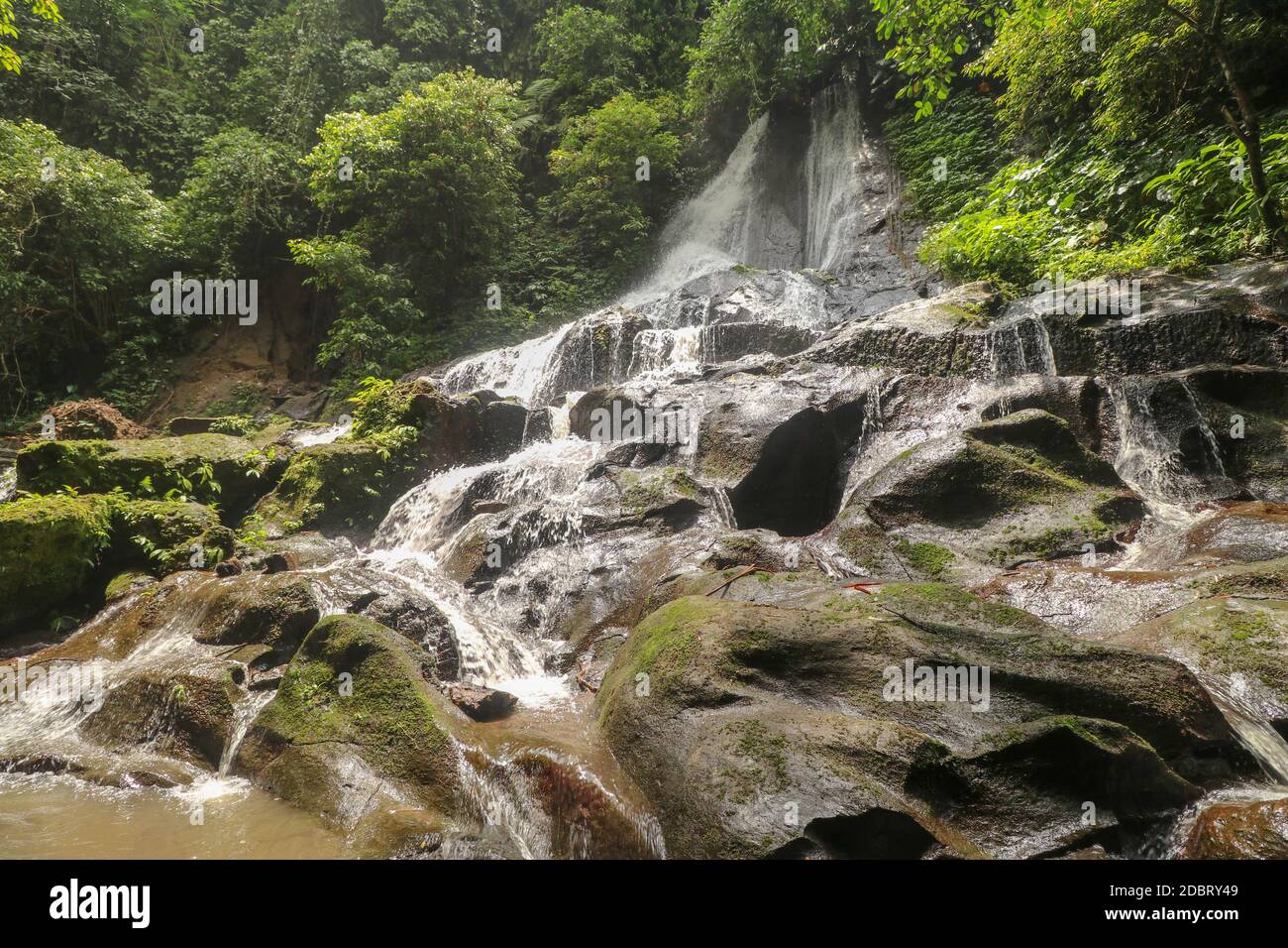 Scenic cascade Goa Giri Campuhan waterfall in tropical jungle in Bali ...