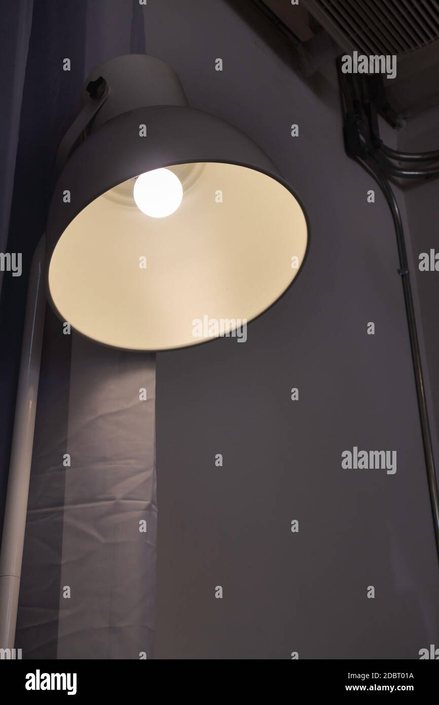 Lamp bulb with light on the stand, stock photo Stock Photo - Alamy