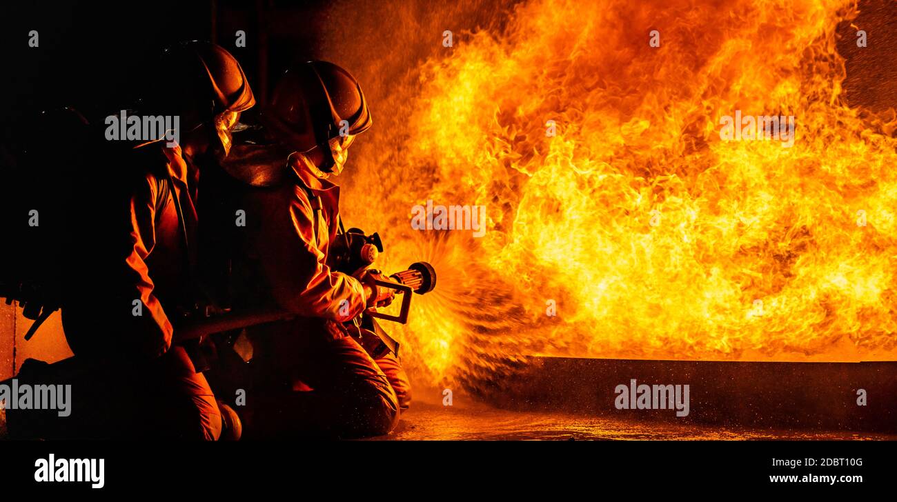 Panoramic firefighters using Twirl water fog type fire extinguisher to ...