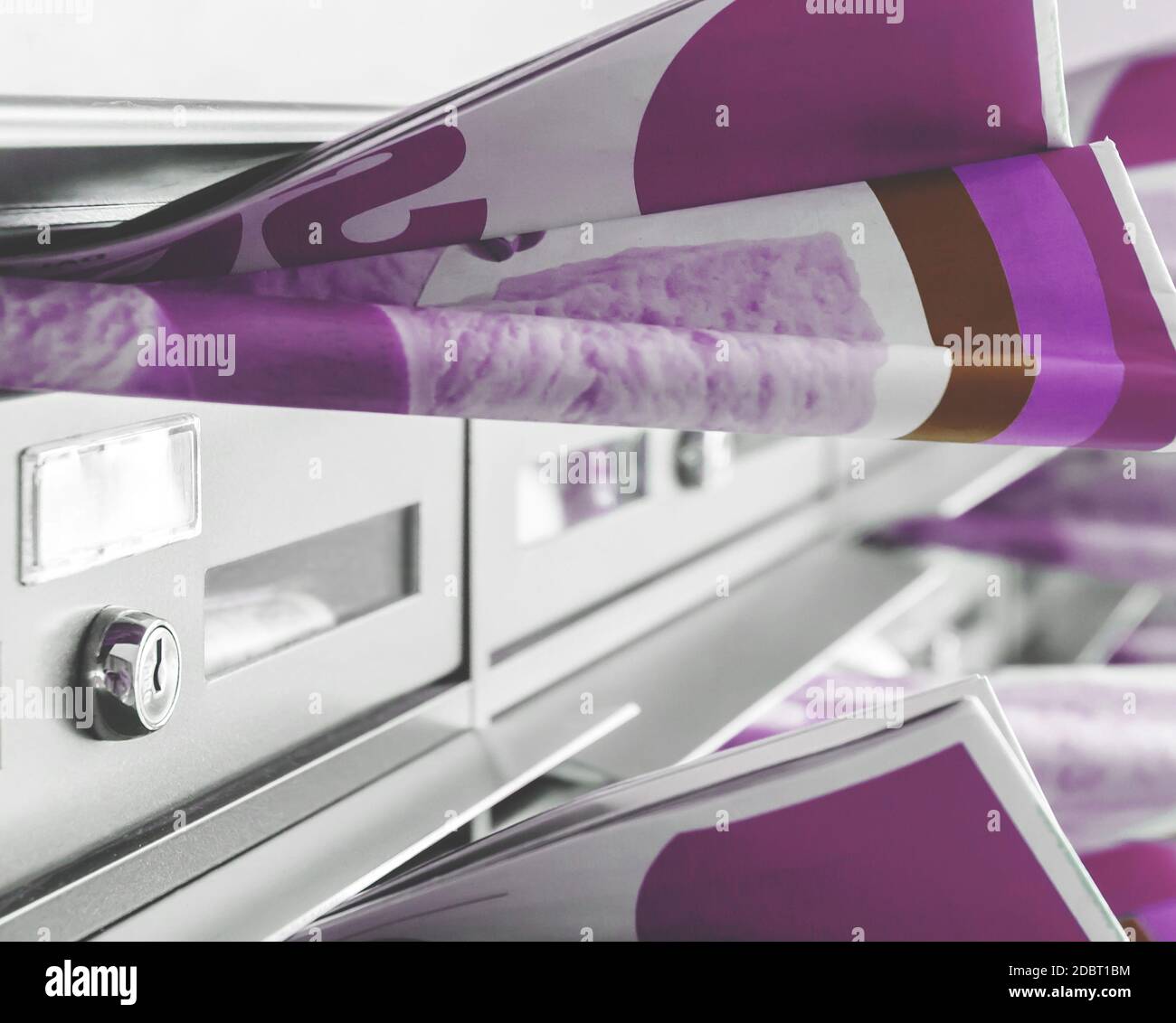 Mail boxes filled of leaflets. Many flyers in mailboxes, symbol for ...