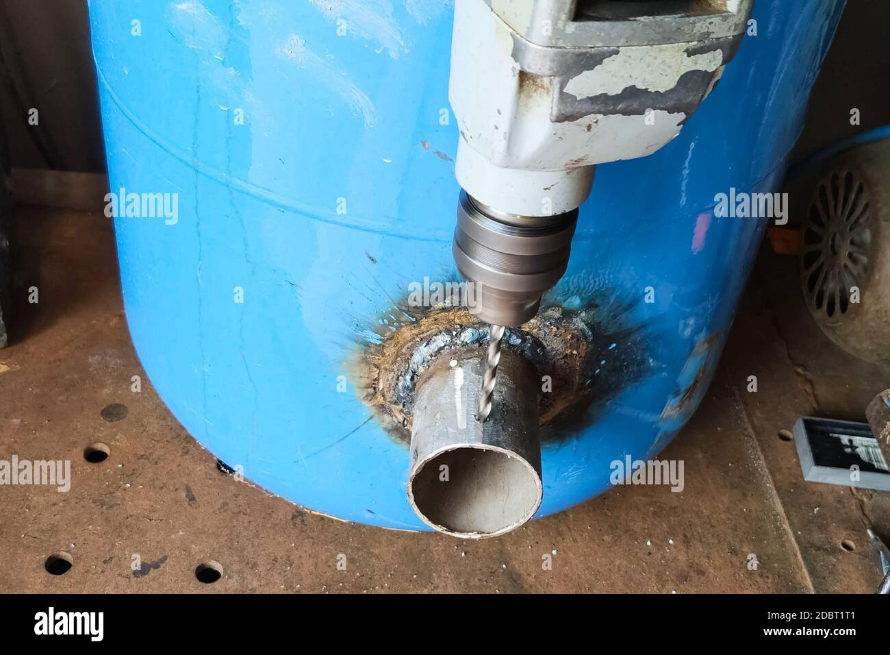 Making a homemade smelting stove. Metal welding Stock Photo - Alamy