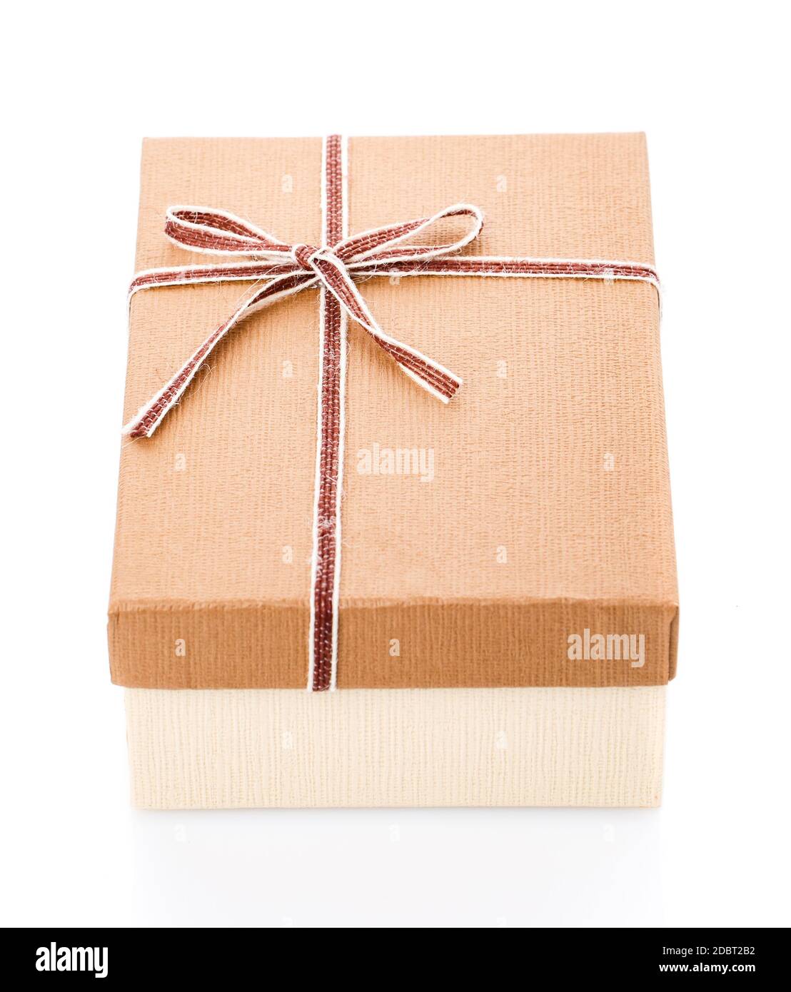 Light brown festive gift box with ribbon on white background Stock ...