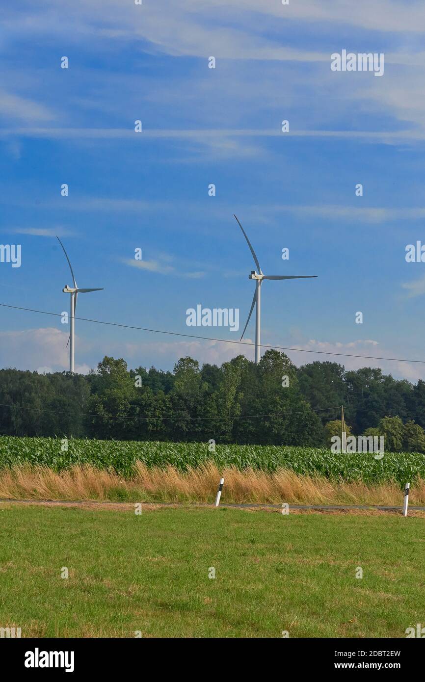 windmills in a rural environment with meadows and trees Stock Photo - Alamy