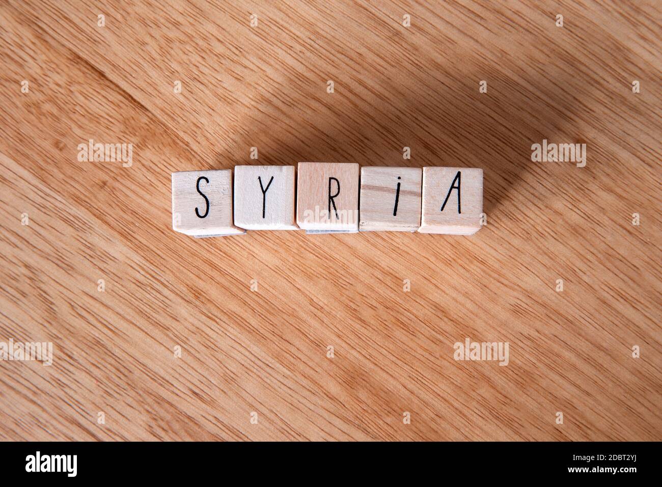 The Country Syria written on wooden cubes on wooden background, Country ...