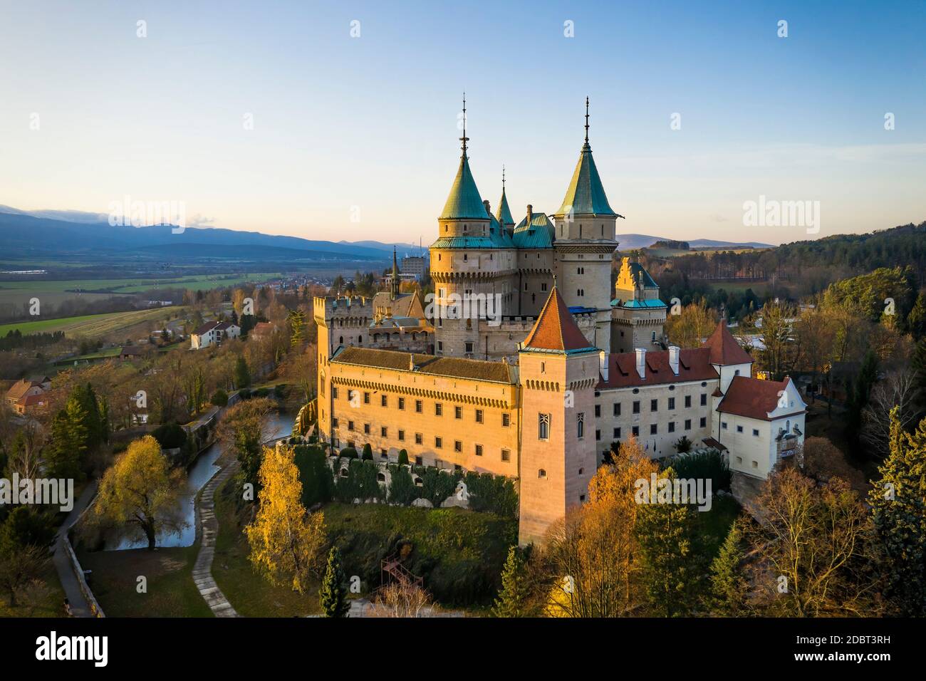 Side view of Bojnice castle with one wall bathed in lovely morning ...