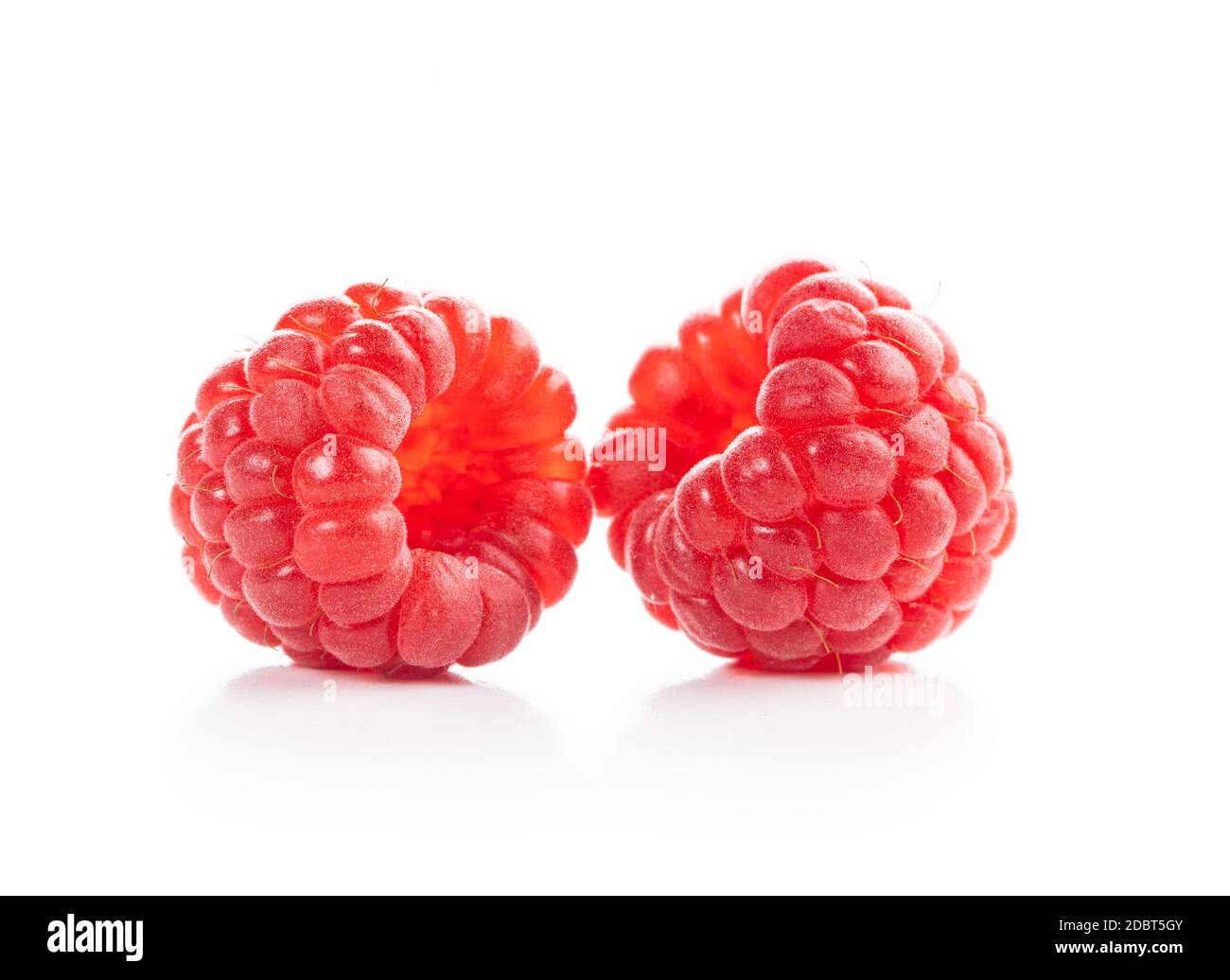 Ripe red raspberries isolated on white background Stock Photo - Alamy