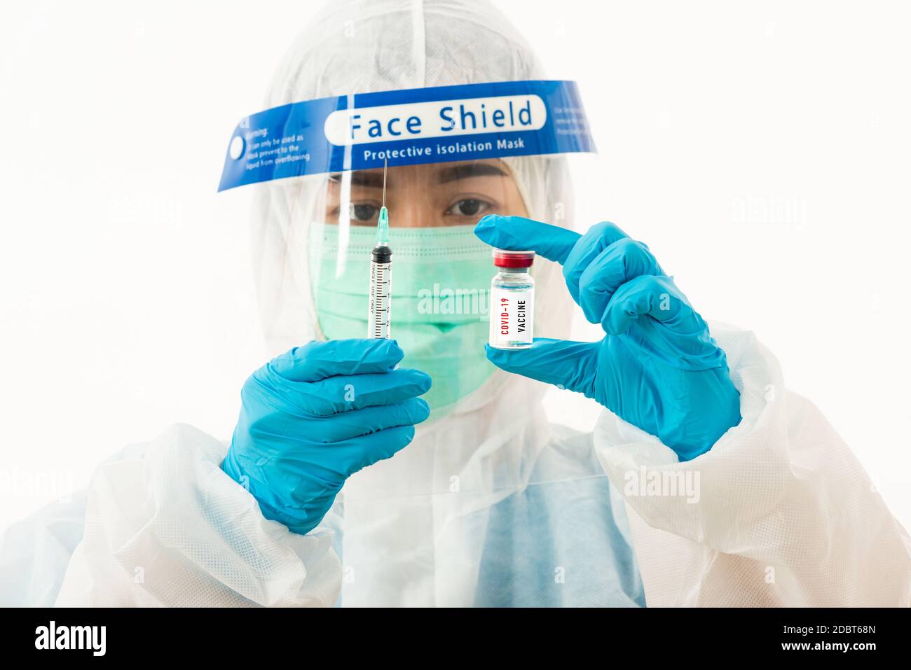 Woman medical scientist in PPE uniform wearing a face mask protective ...