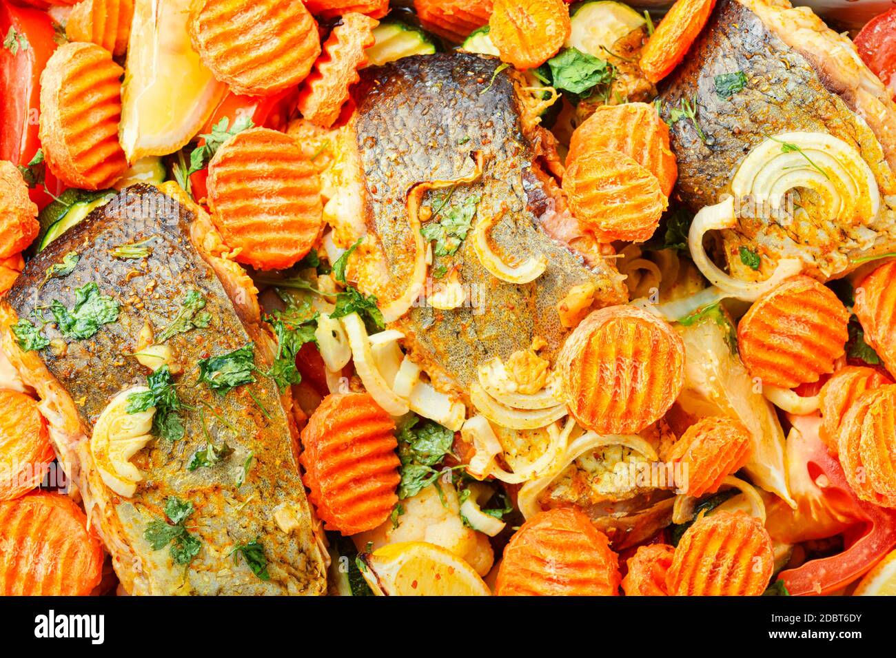 Baked fish steaks with grilled vegetables.Food background,close up ...