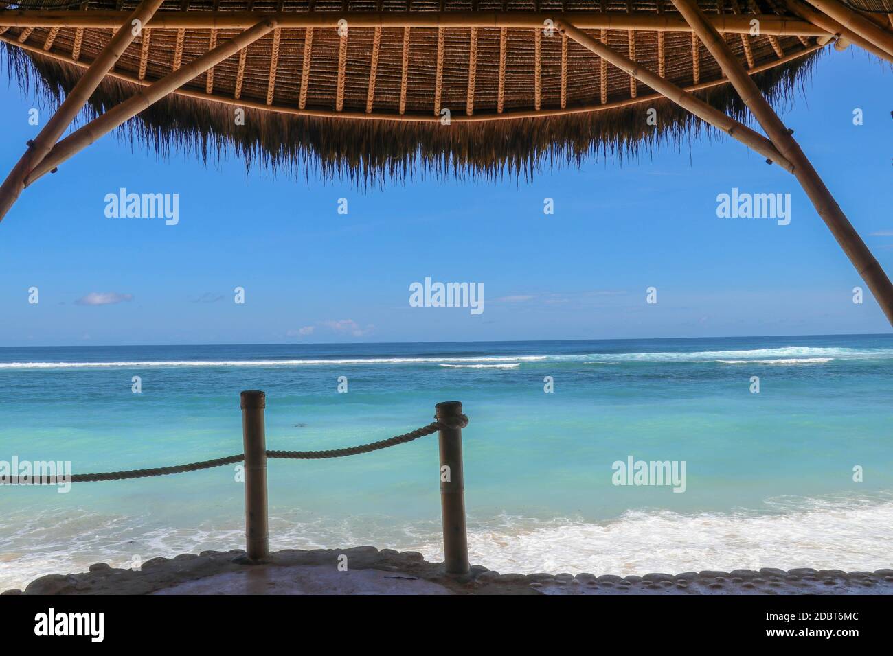 Outdoor restaurant at the beach. Cafe on the beach, ocean and sky. View ...