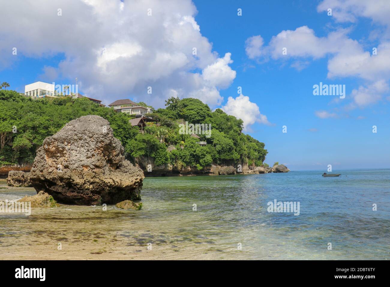 Sea with giant stones and sand island hi-res stock photography and ...