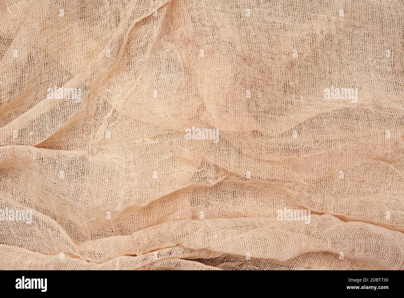 folded beige cotton gauze kitchen napkin, fabric texture full frame ...