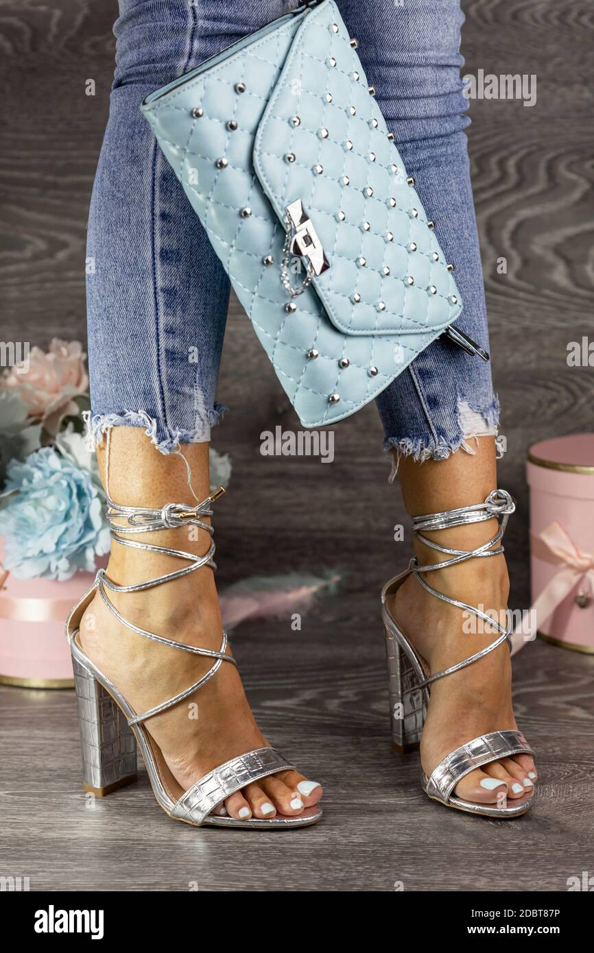 Woman posing in stylish high heel shoes. Beauty and Fashion concept ...