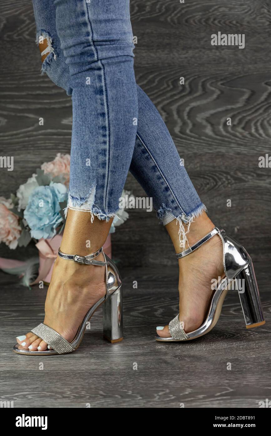 Woman posing in stylish high heel shoes. Beauty and Fashion concept ...