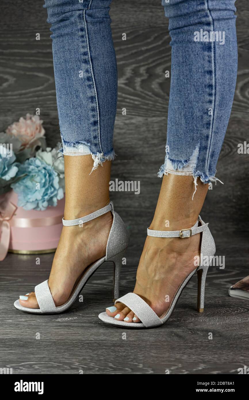 Woman posing in stylish high heel shoes. Beauty and Fashion concept ...