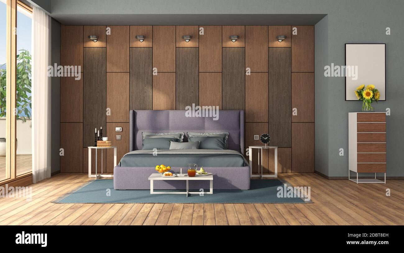Modern bedroom with double bed against wooden panel , coffeetable and ...