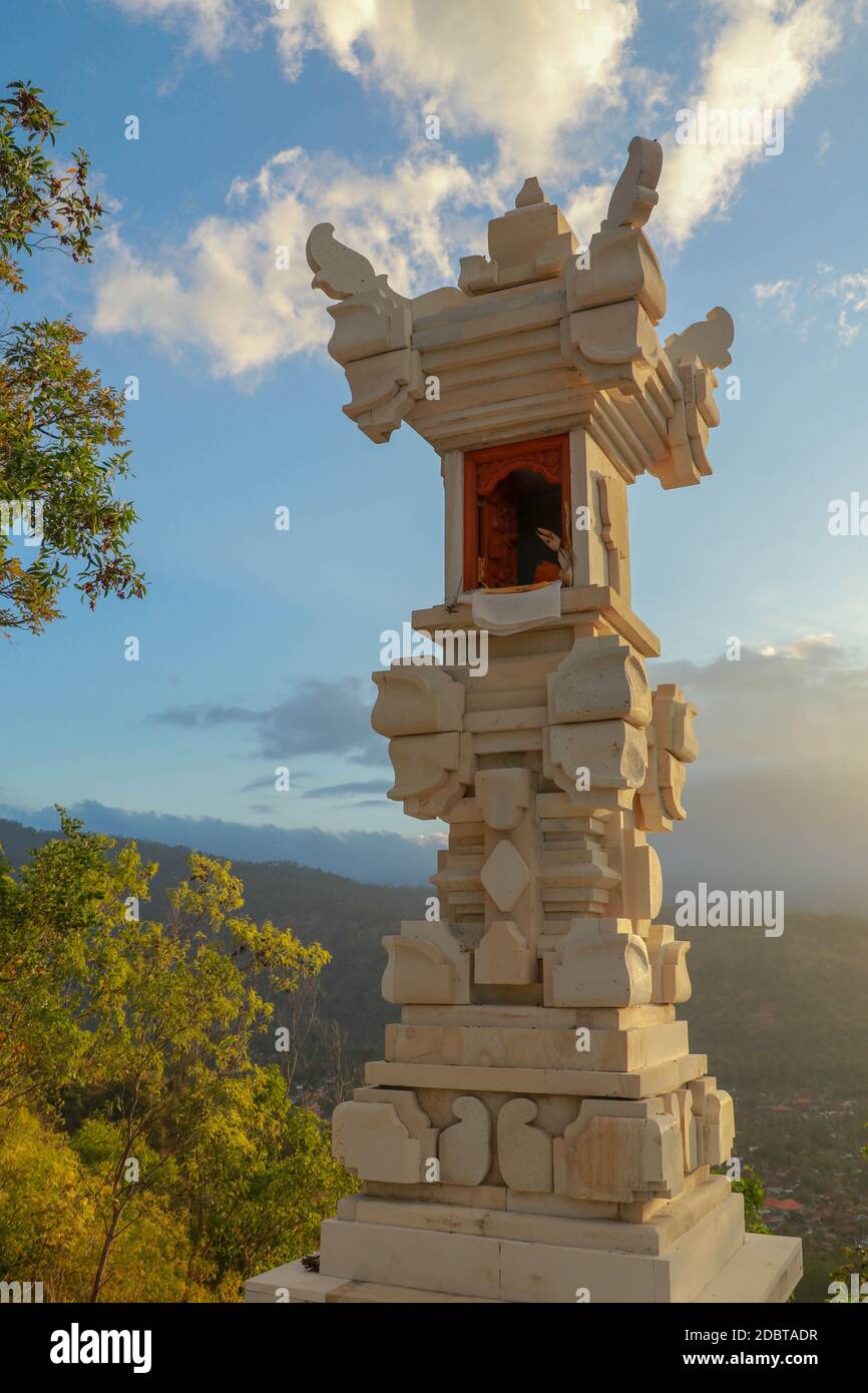 Hindu offering altar located in Bali in Indonesia. Dramatic sunset ...