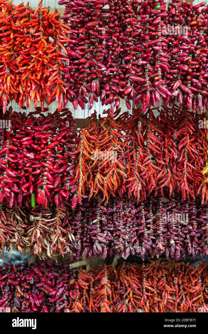 Chili peppers on string in Funchal on Madeira. Portugal Stock Photo - Alamy