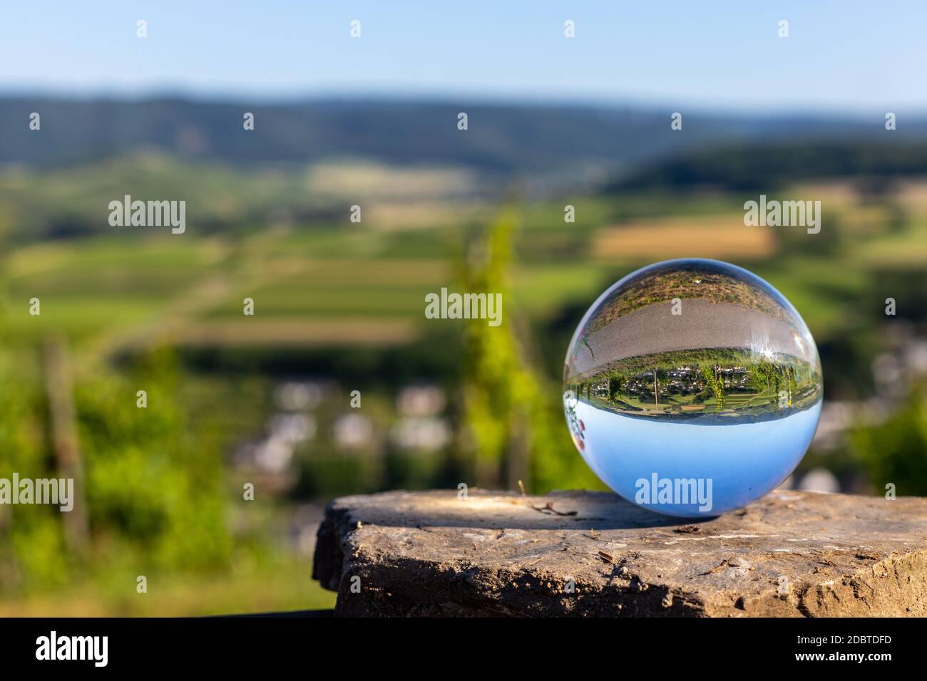 Crystal ball on shale stone with defocused river Moselle valley in ...