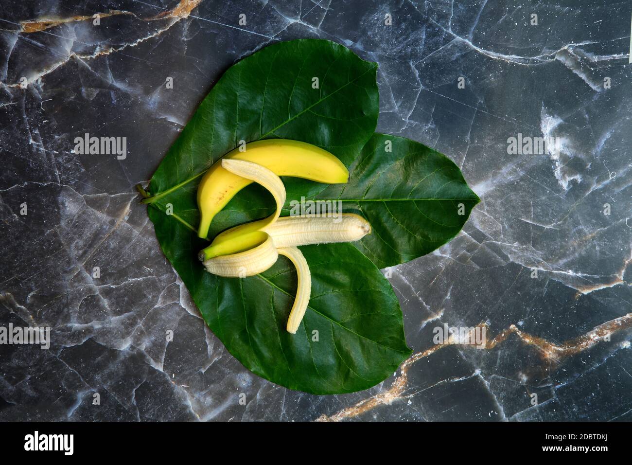 Fresh banana on natural background Stock Photo - Alamy