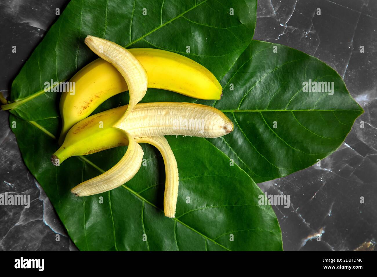 Fresh banana on natural background Stock Photo - Alamy