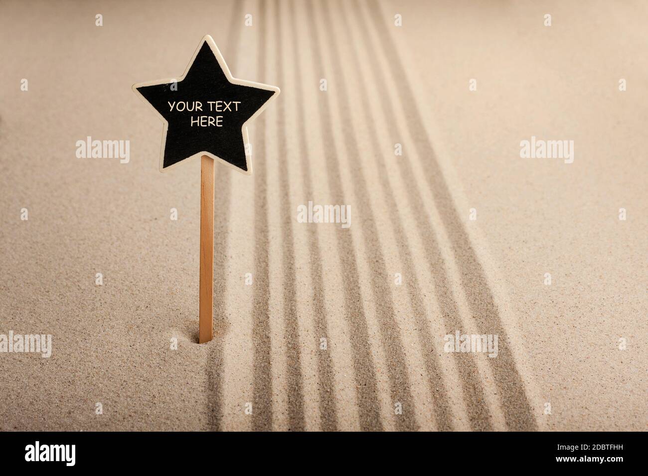 Pointer star standing in the sand, can be used as background Stock ...