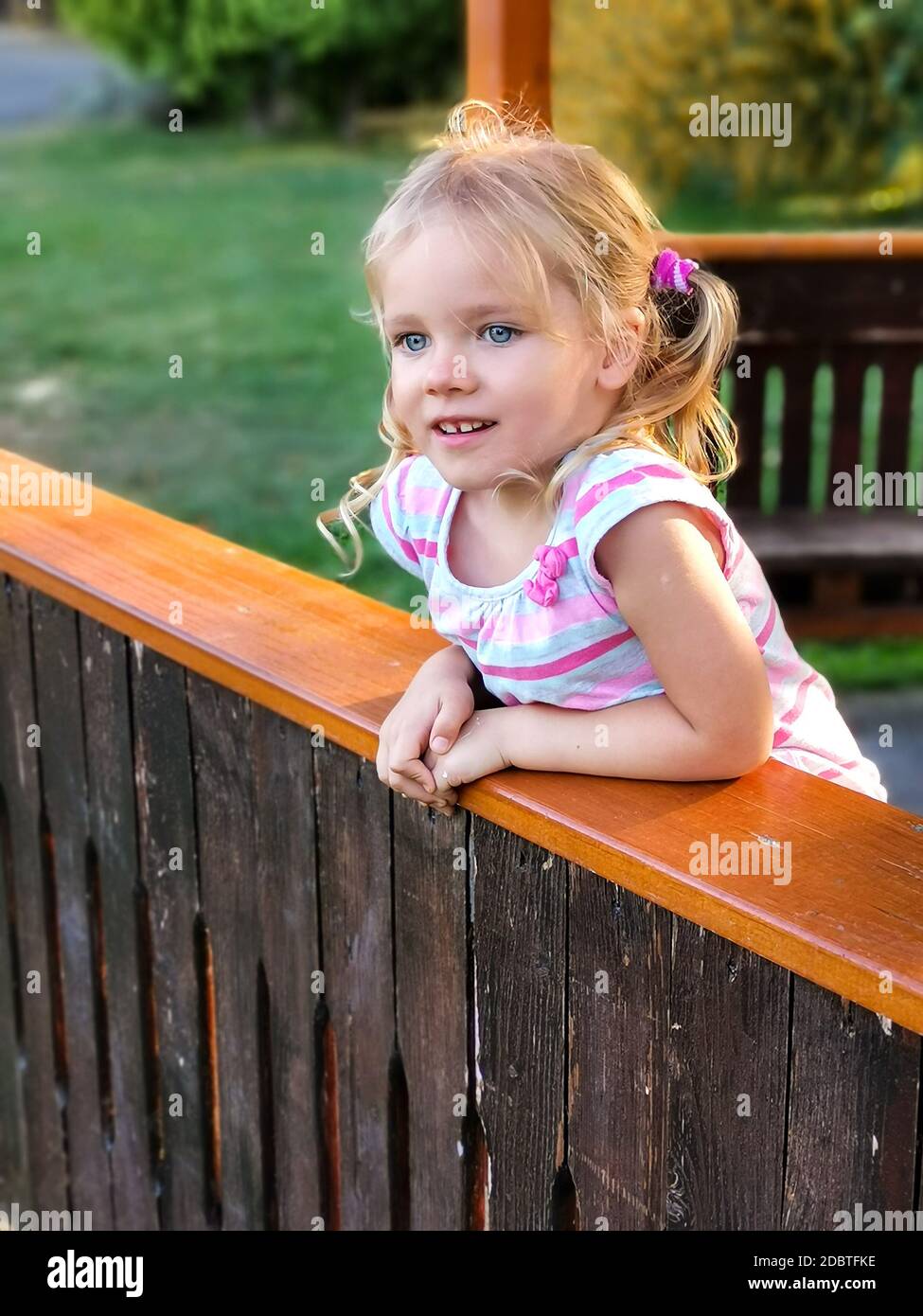 Adorable girl child looks straight ahead with curiosity. Portrait of ...