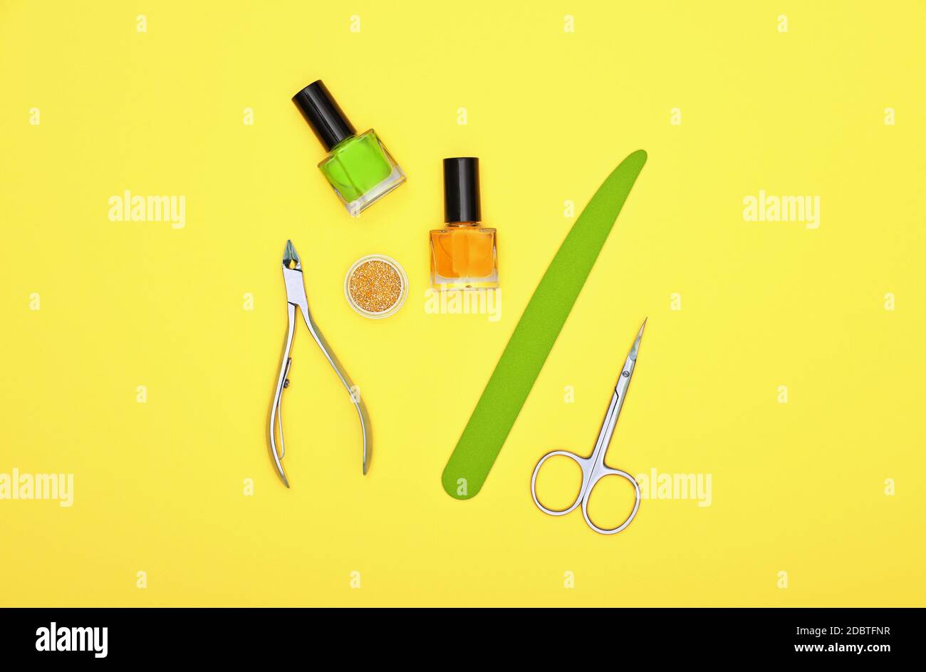 Close up feminine hygiene, beauty, nail care and manicure set on yellow ...