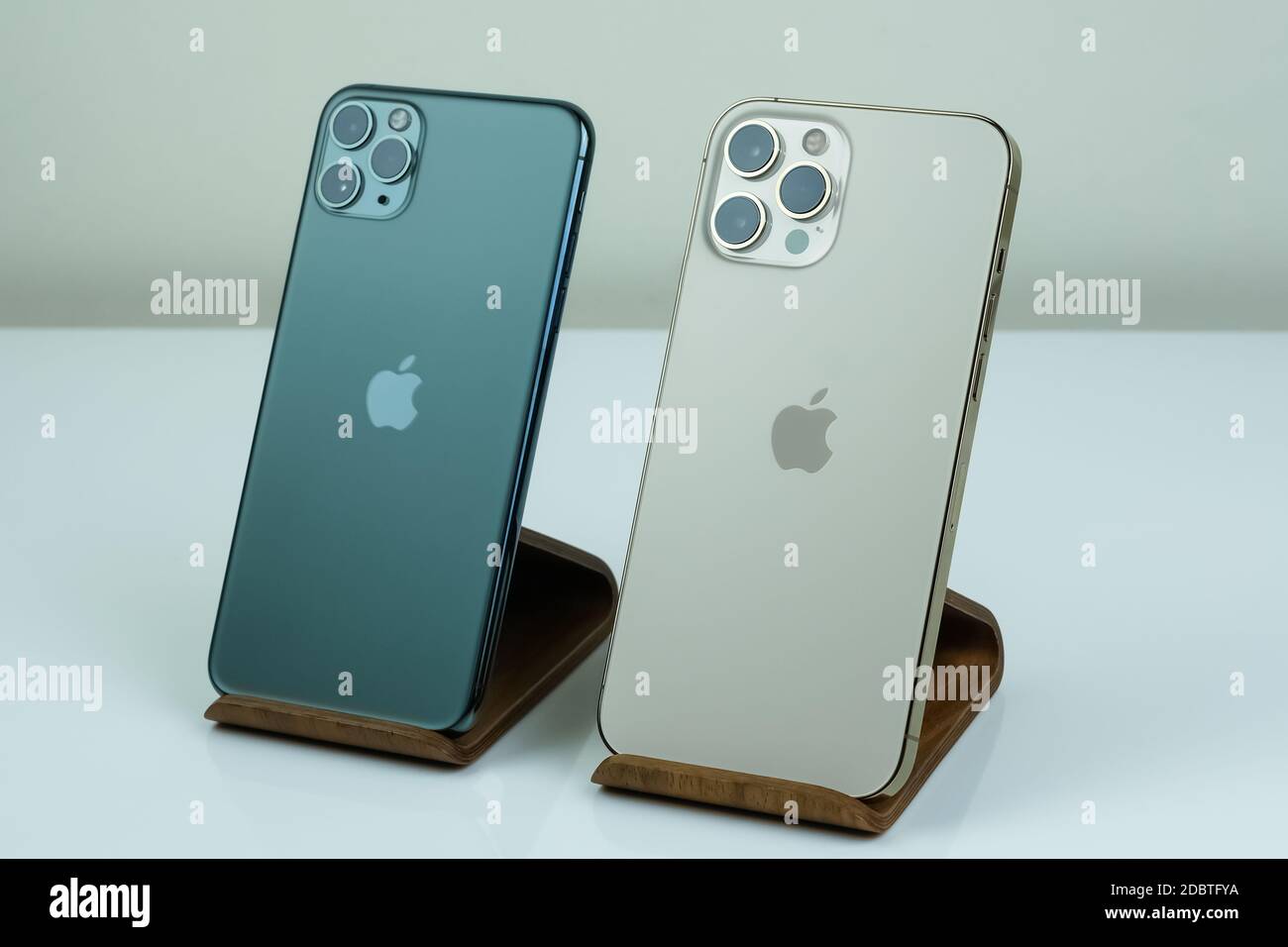 iPhone 12 Pro Max in Gold next to iPhone 11 Pro Max in Midnight Green ...