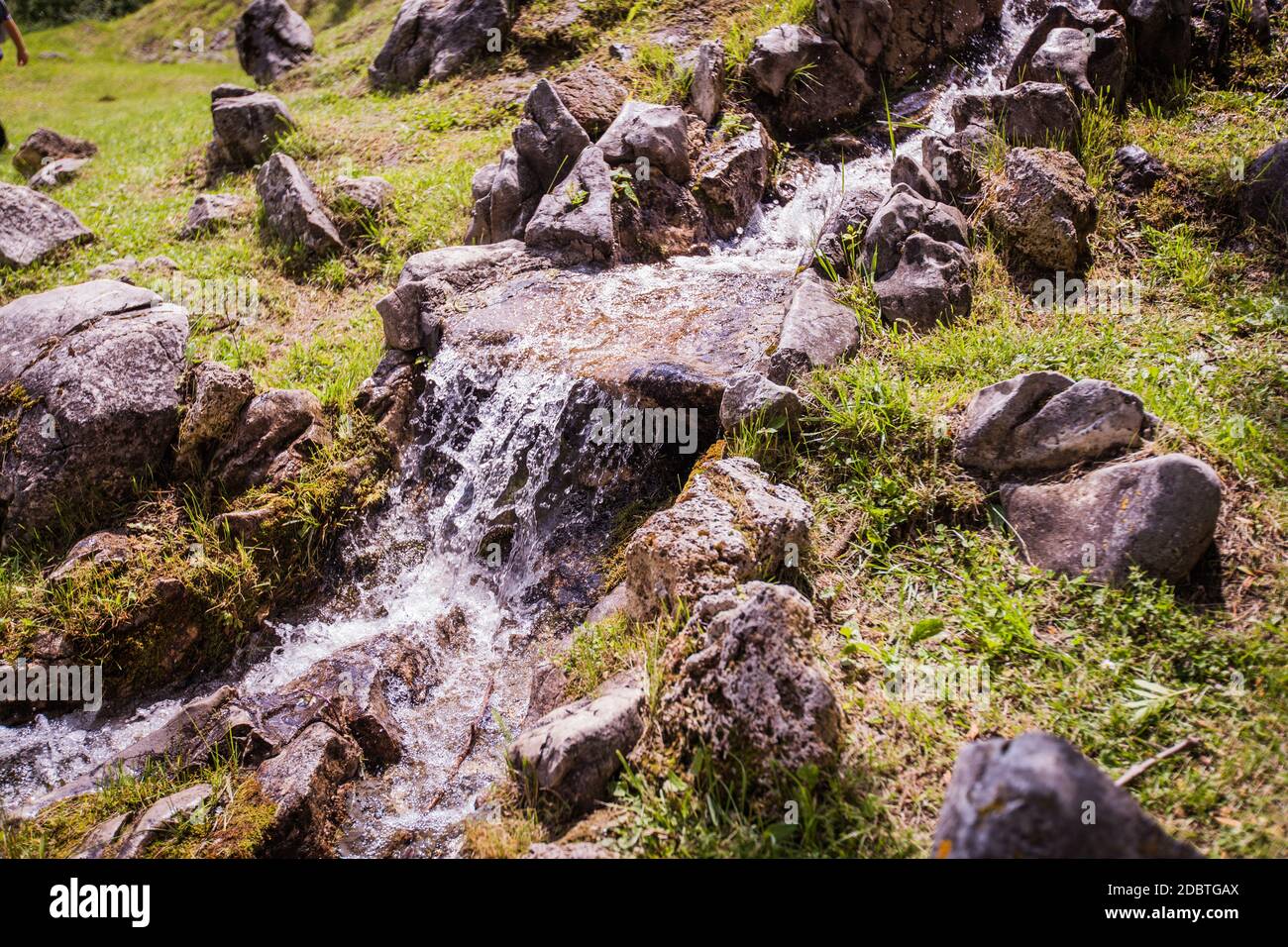 Small waterfall rocks cascade, fresh running water, summer daylight ...