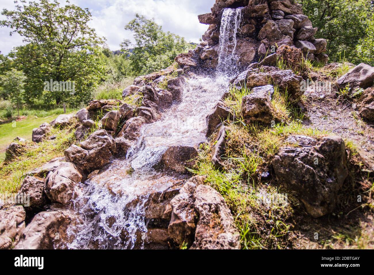 Small waterfall rocks cascade, fresh running water, summer daylight ...