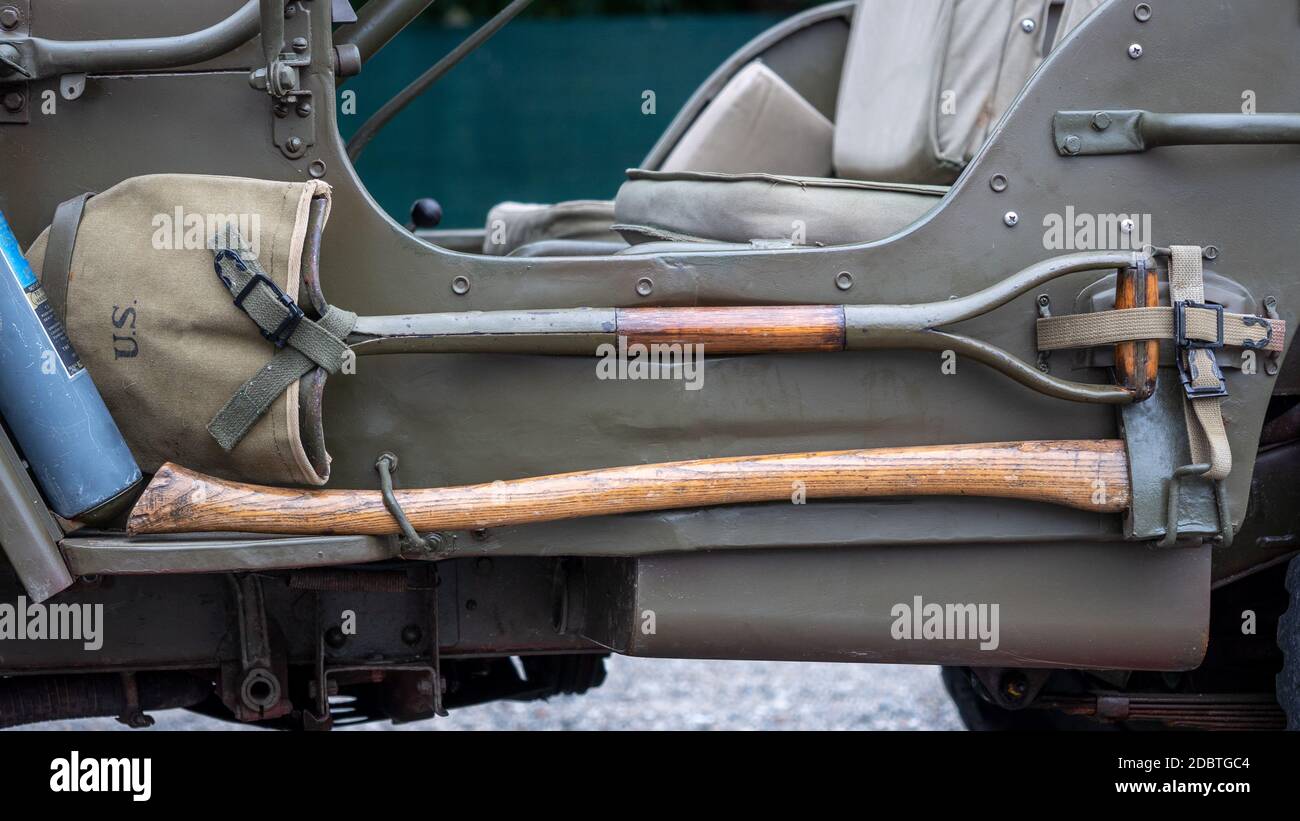Detail of different work tools on the side of the military vehicle ...