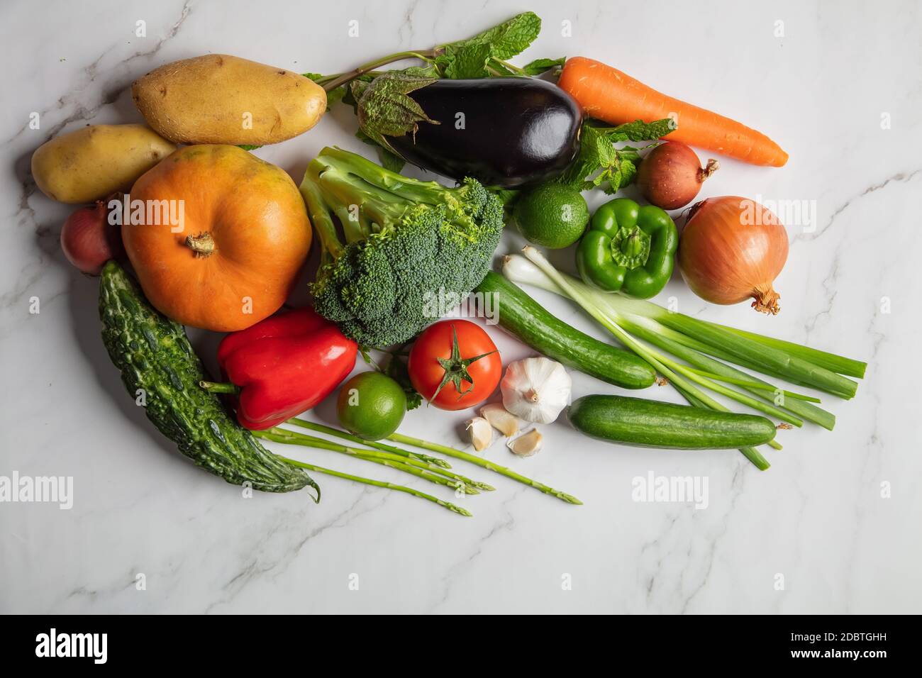 fresh vegetable on white marble background Stock Photo - Alamy