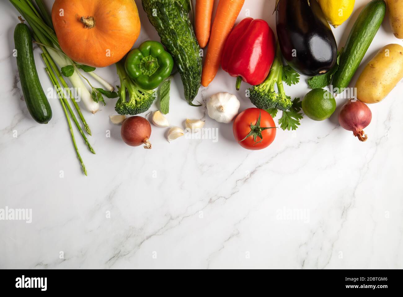 fresh vegetable on white marble background Stock Photo - Alamy