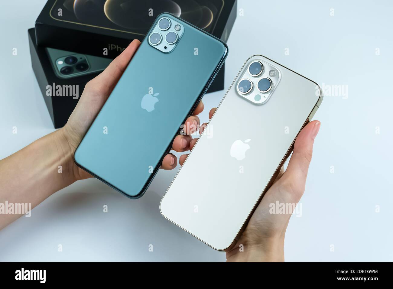 iPhone 12 Pro Max in Gold next to iPhone 11 Pro Max in Midnight Green ...