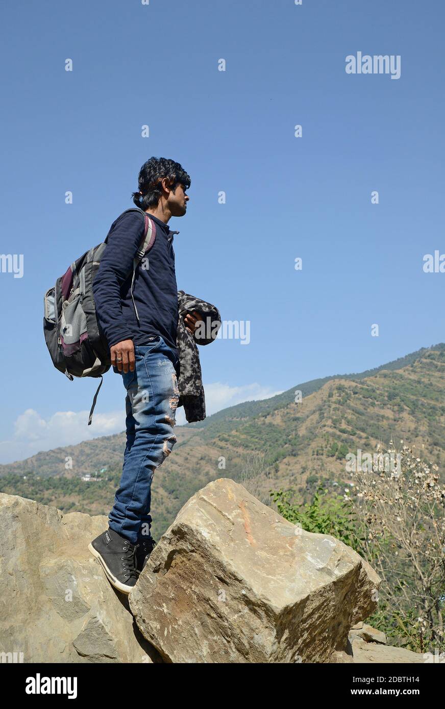 Man resting on the rock in Himachal Pradesh Stock Photo - Alamy