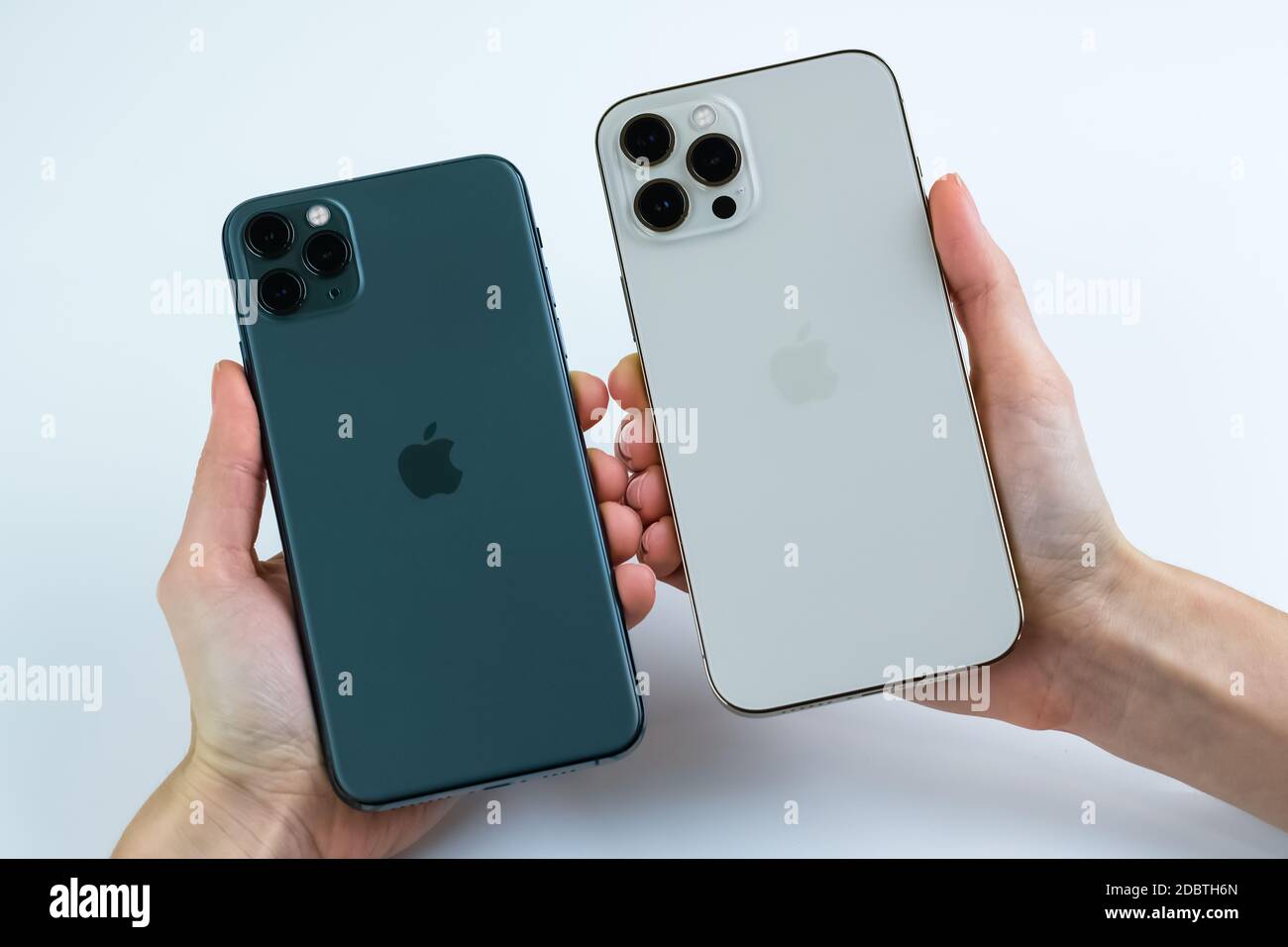iPhone 12 Pro Max in Gold next to iPhone 11 Pro Max in Midnight Green ...