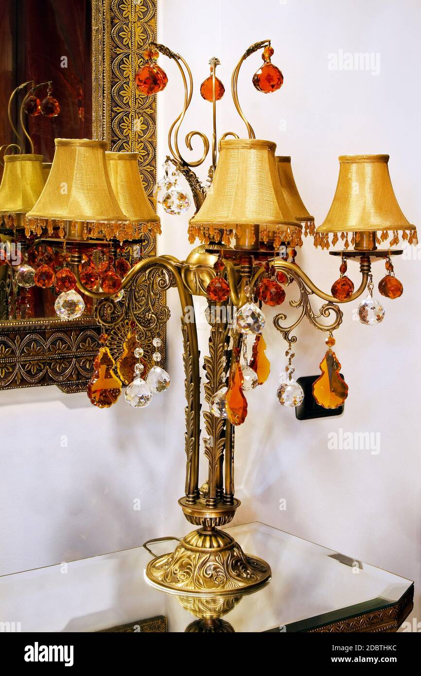 Antique brass table lamp with decorative stones Stock Photo - Alamy
